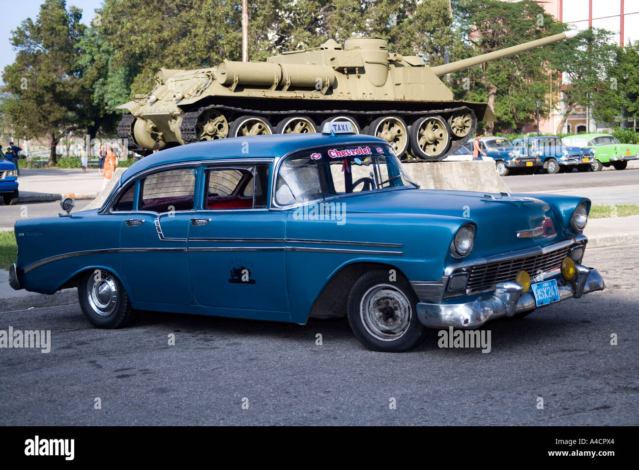 Old American car parked by the Soviet tank outside the Museo de la ...