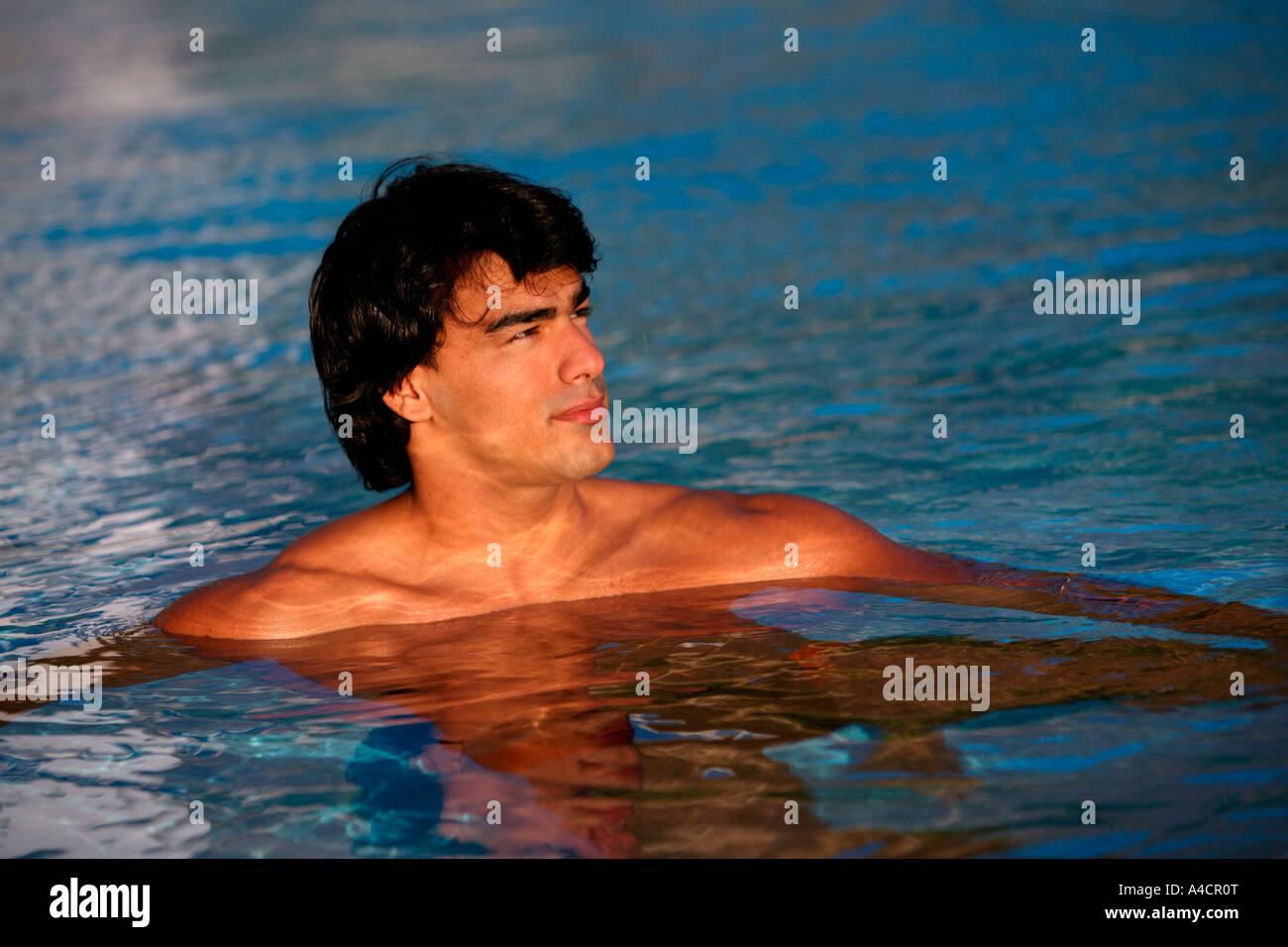 Man in swimming pool Stock Photo - Alamy