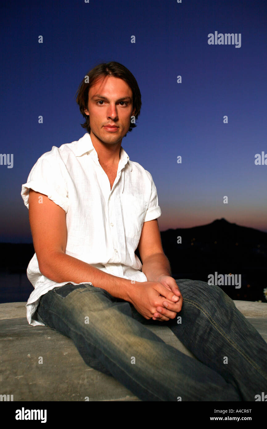 Adult man sitting terrace hi-res stock photography and images - Alamy