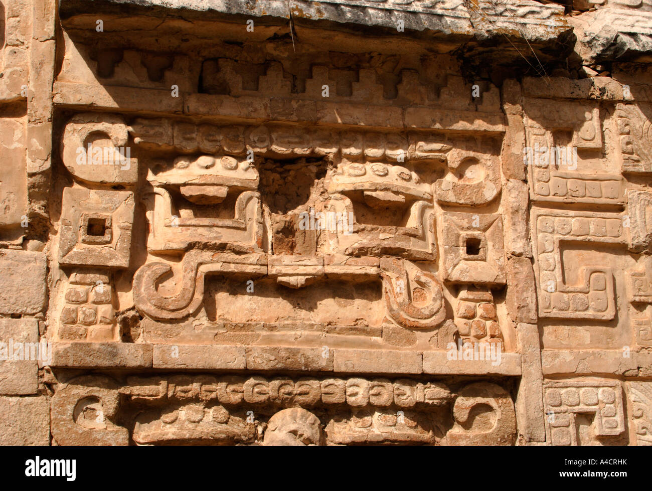 Puuc style buildings with figures of the Rain God Chaac at Chichen Itza ...