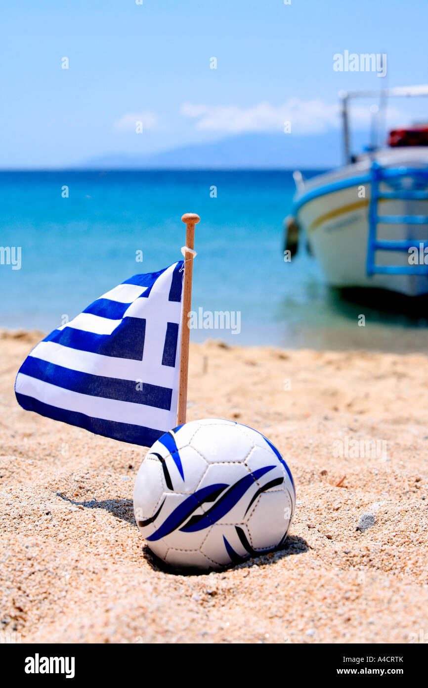 Ball and Greek flag on beach Stock Photo - Alamy