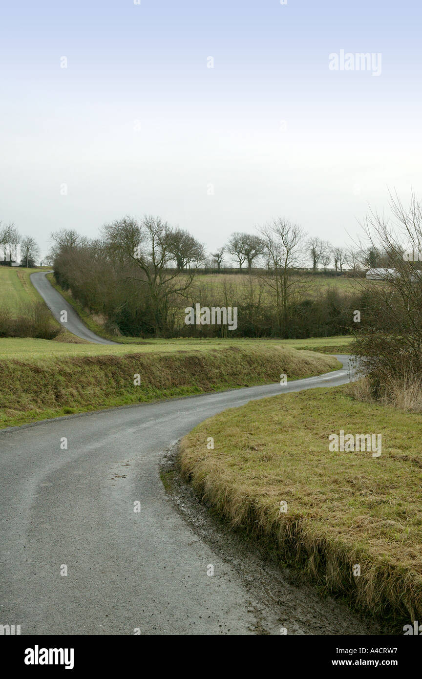 Winding road in rural agricultural landscape location Stock Photo - Alamy