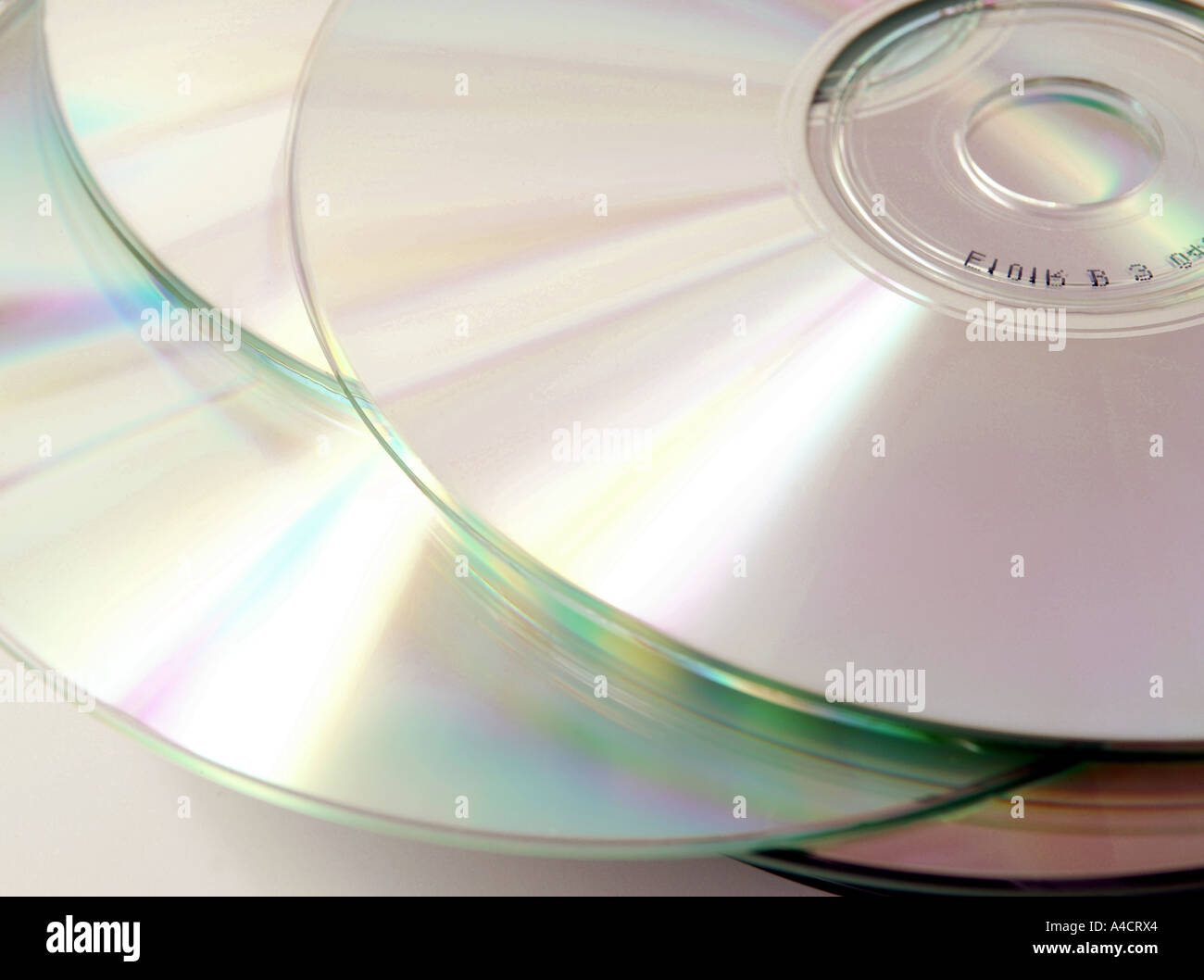 Closeup of cds on a white studio background with small focus point ...