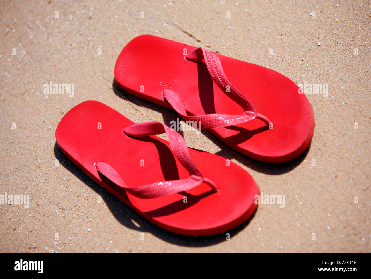 Flip flops on the beach Stock Photo - Alamy