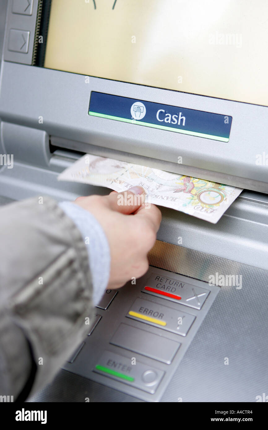 Someone Using A Cash Machine Or Point Stock Photo - Alamy