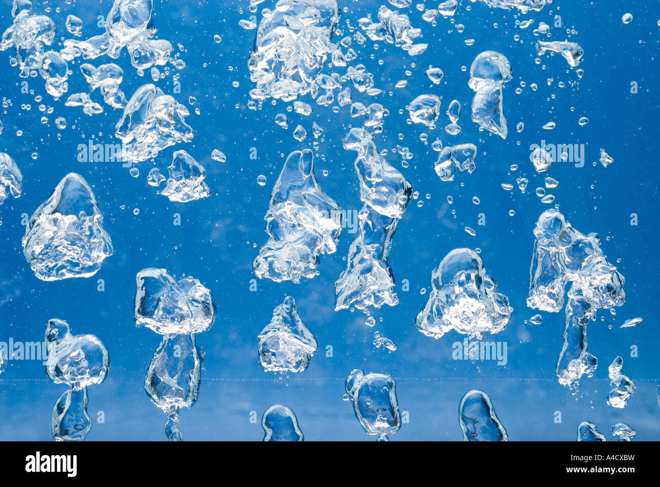 Many Air bubbles under water rising to the water surface Stock Photo ...