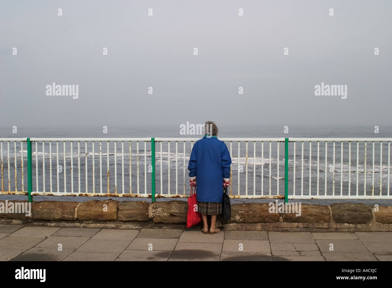 old lady staring out to sea Stock Photo - Alamy
