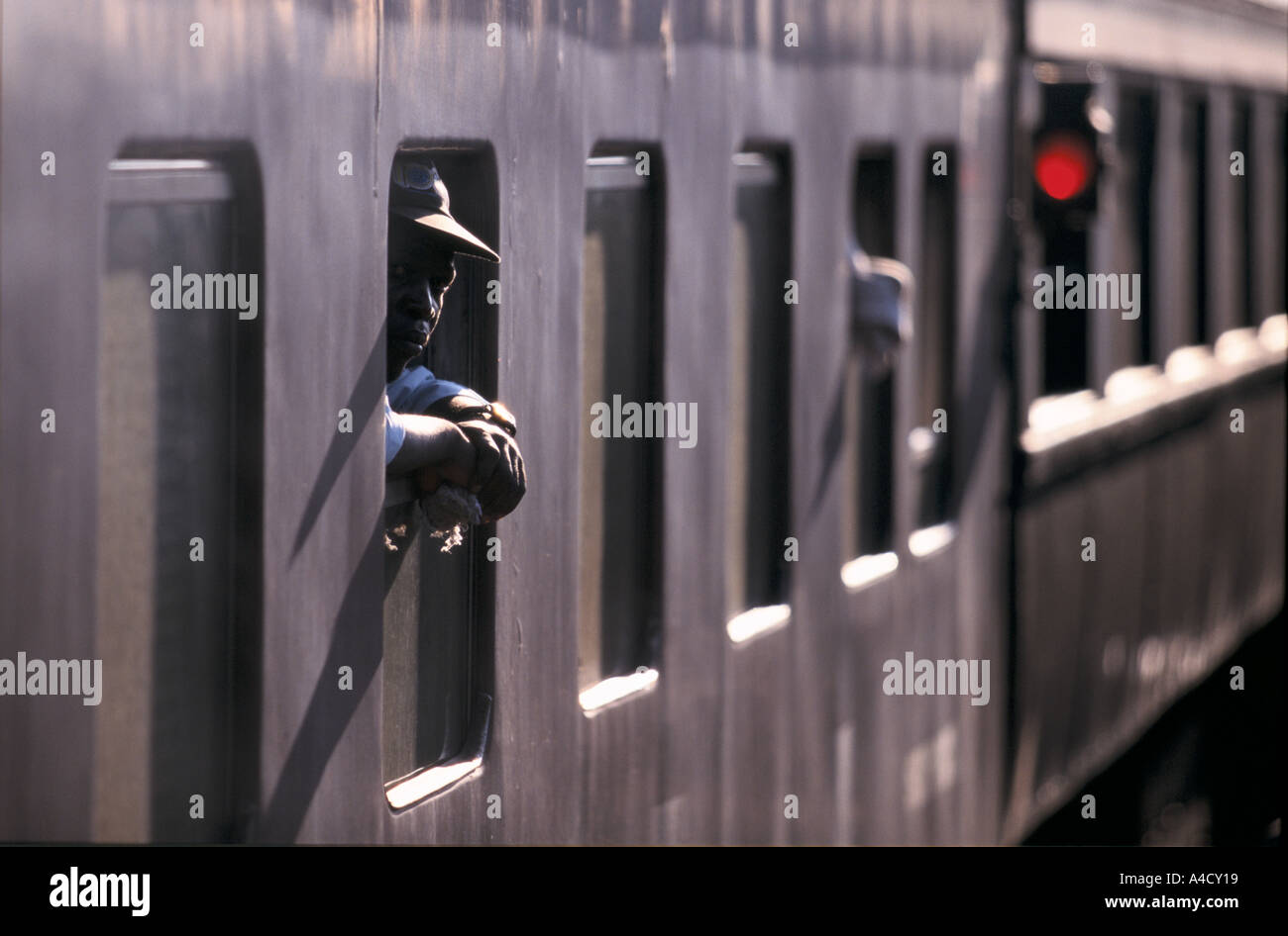 Man leaning out of window on train hi-res stock photography and images ...