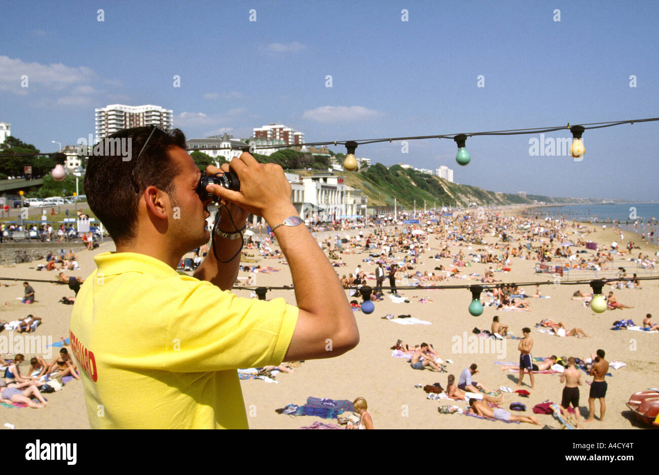 Man sitting in lifeguard chair hi-res stock photography and images - Alamy