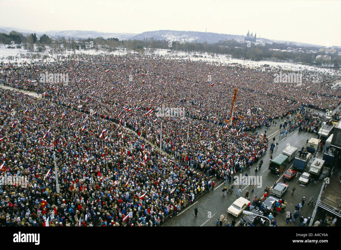 Crowds of people at a rally during the Velvet Revolution in Prague ...