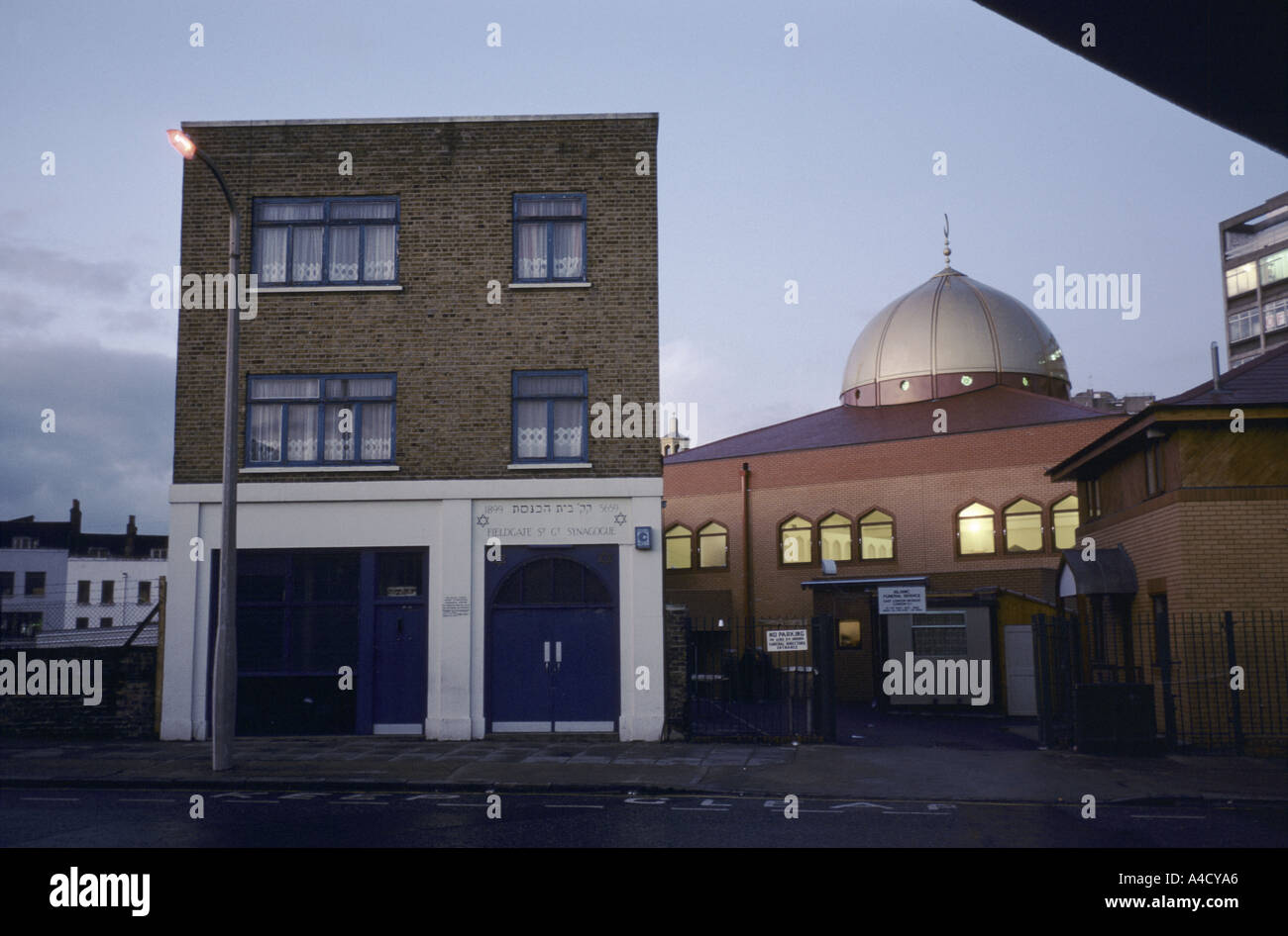A synagogue and a mosque stand next to each other. Whitechapel, London ...