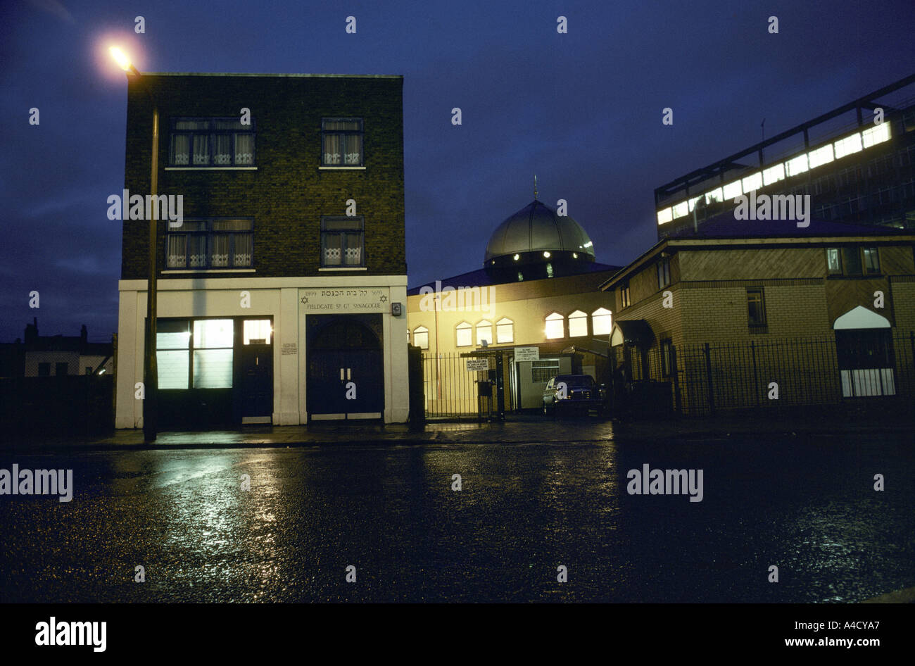 A synagogue and a mosque stand next to each other. Whitechapel, London ...