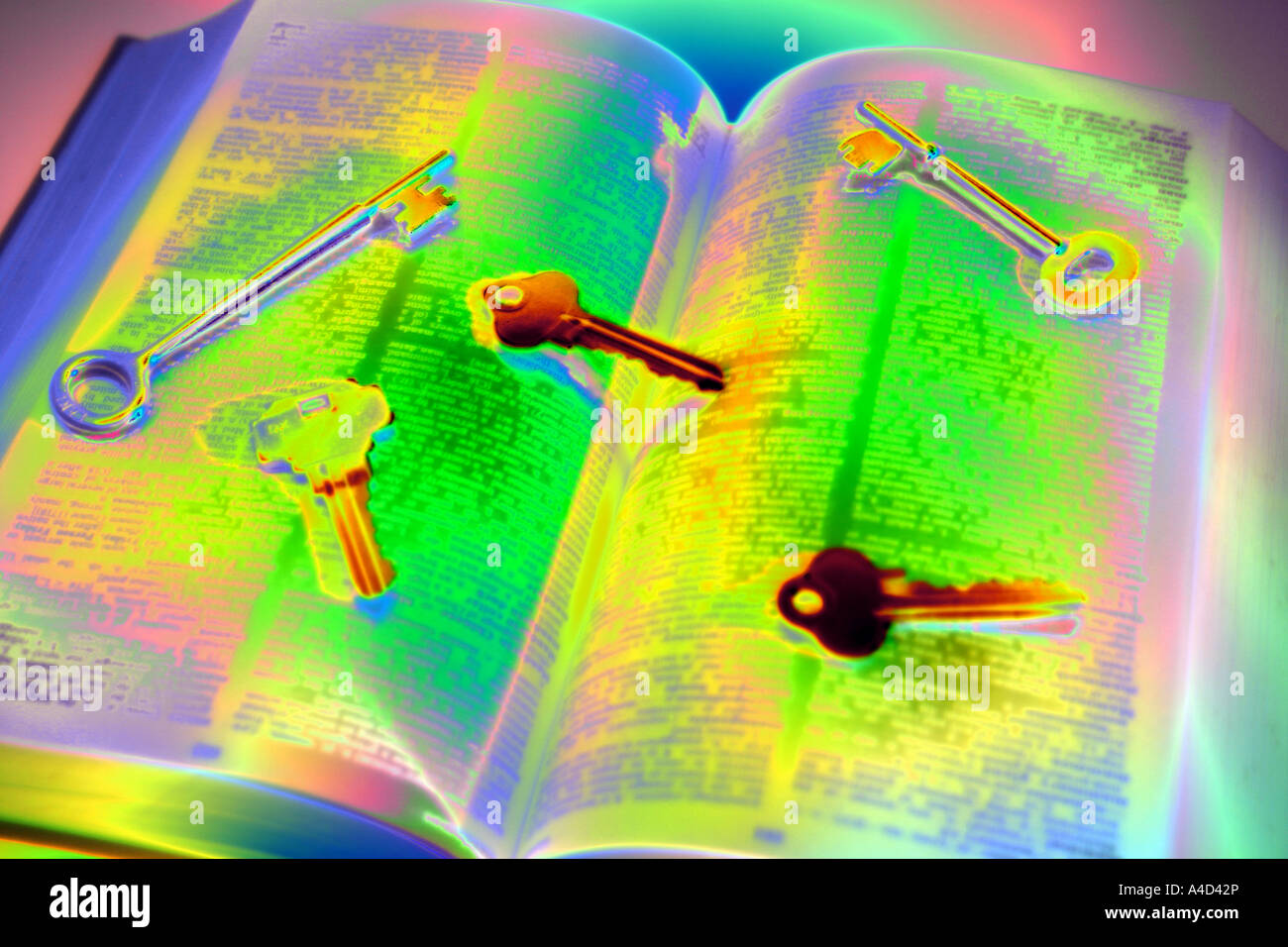 Keys on open book Stock Photo - Alamy