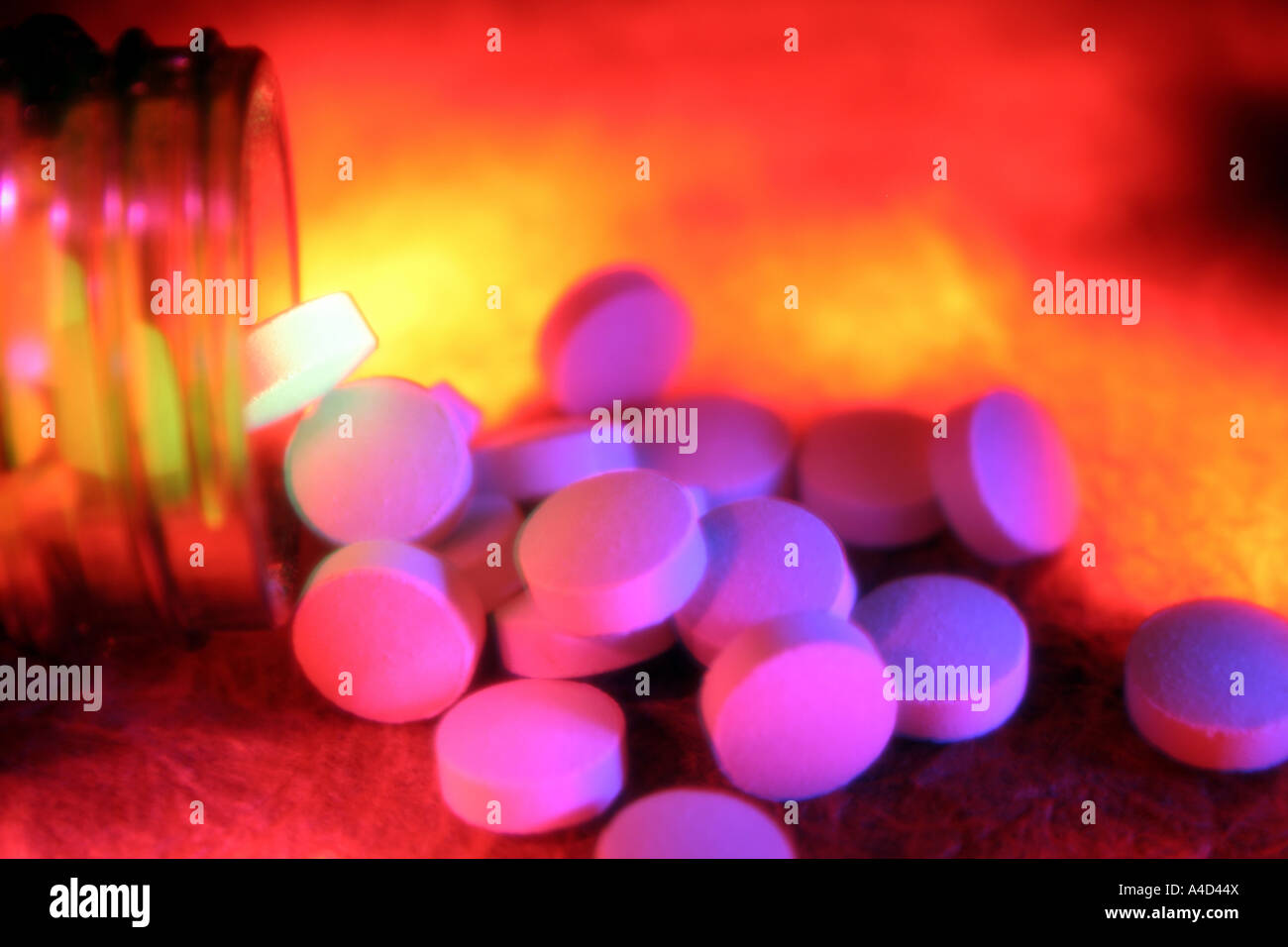 Pills pouring from open bottle Stock Photo - Alamy