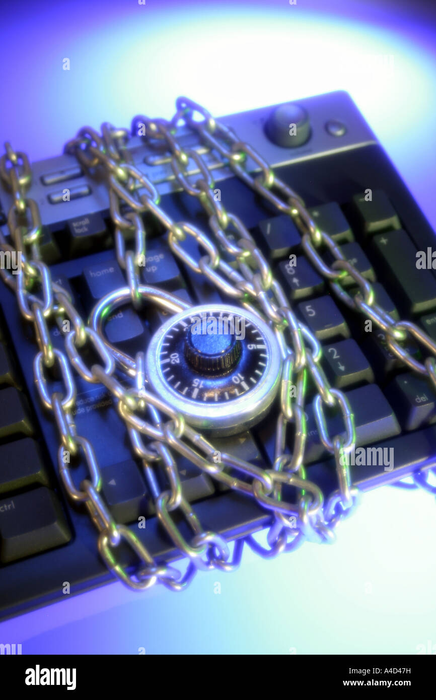 Lock and chain around computer keyboard Stock Photo - Alamy
