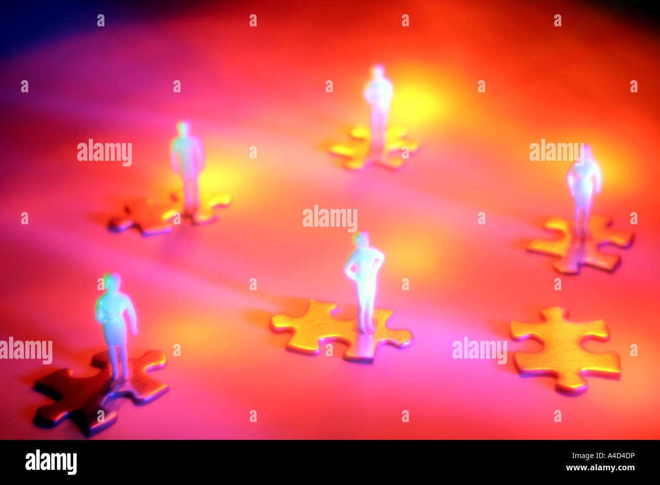 Figurines on puzzle pieces Stock Photo - Alamy