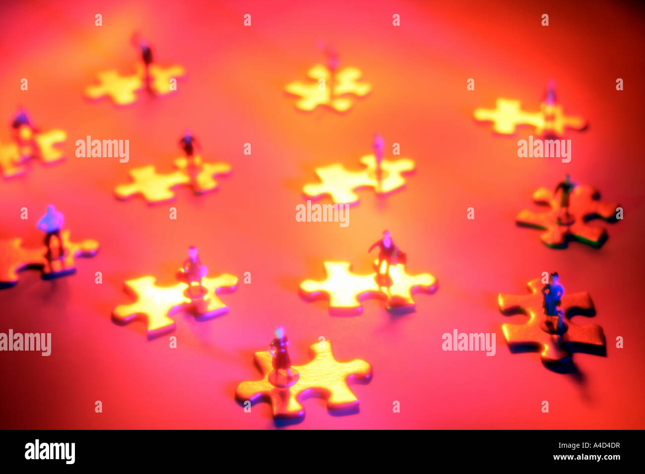 Figures on puzzle pieces Stock Photo - Alamy