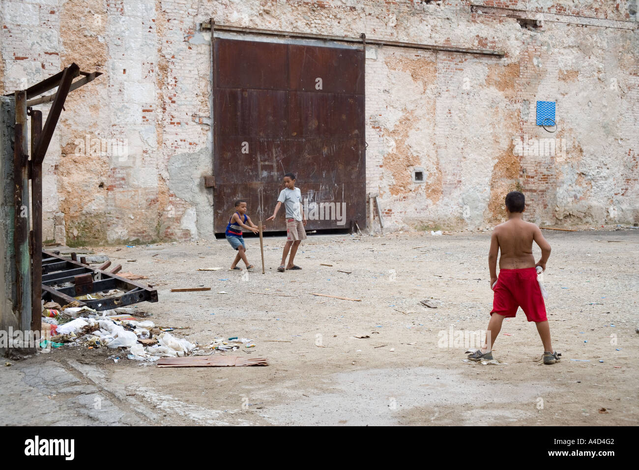 Street Kids playing baseball on some derelict ground in the old town of ...
