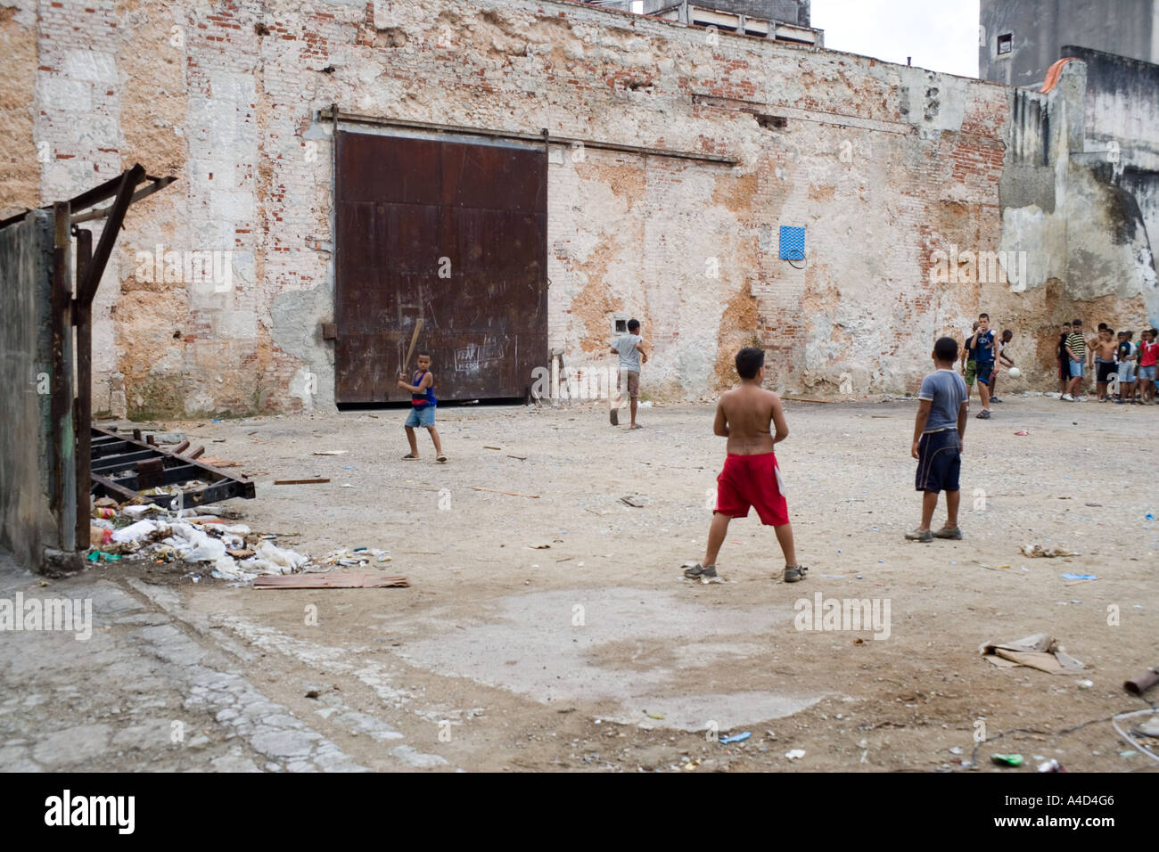 Street Kids playing baseball on some derelict ground in the old town of ...