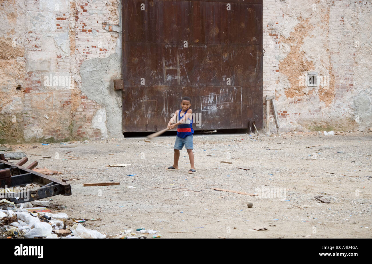 Street Kids playing baseball on some derelict ground in the old town of ...