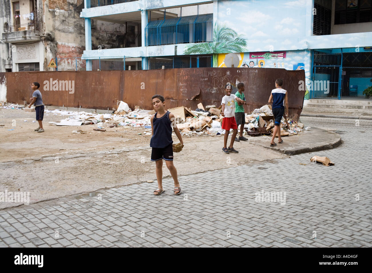 Street Kids playing baseball on some derelict ground in the old town of ...