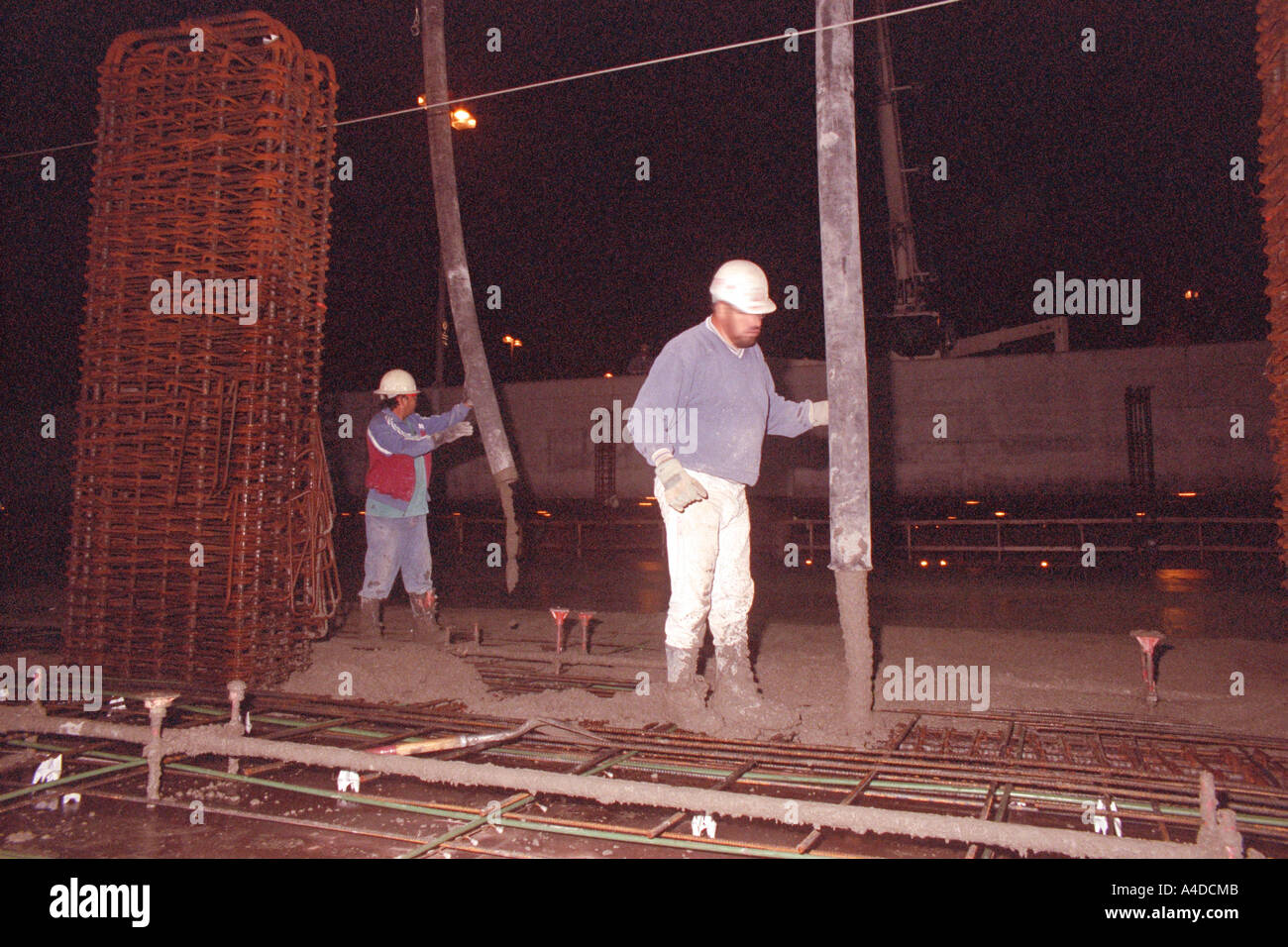 Construction - Worker Directing Concrete Pour Stock Photo - Alamy