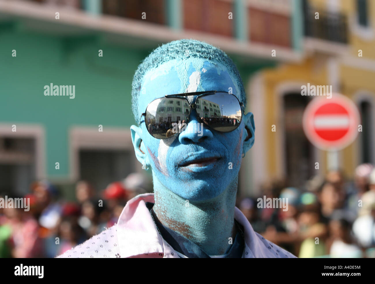 Man with blue painted face at the carnival Mindelo Cape Verde wearing ...