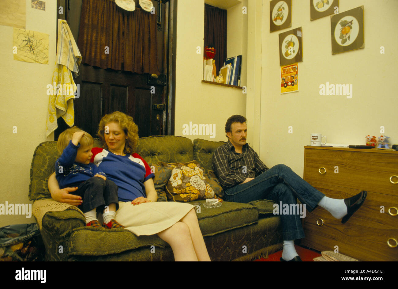 A homeless family with a young child in a hostel living room, London ...