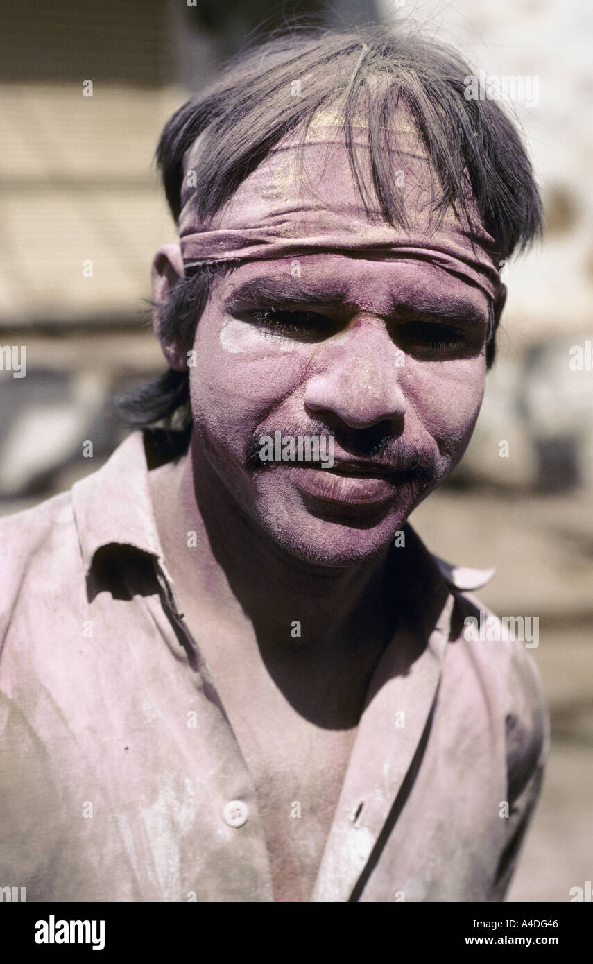 A man covered in coloured flour during the Holi Festival, Rajasthan ...