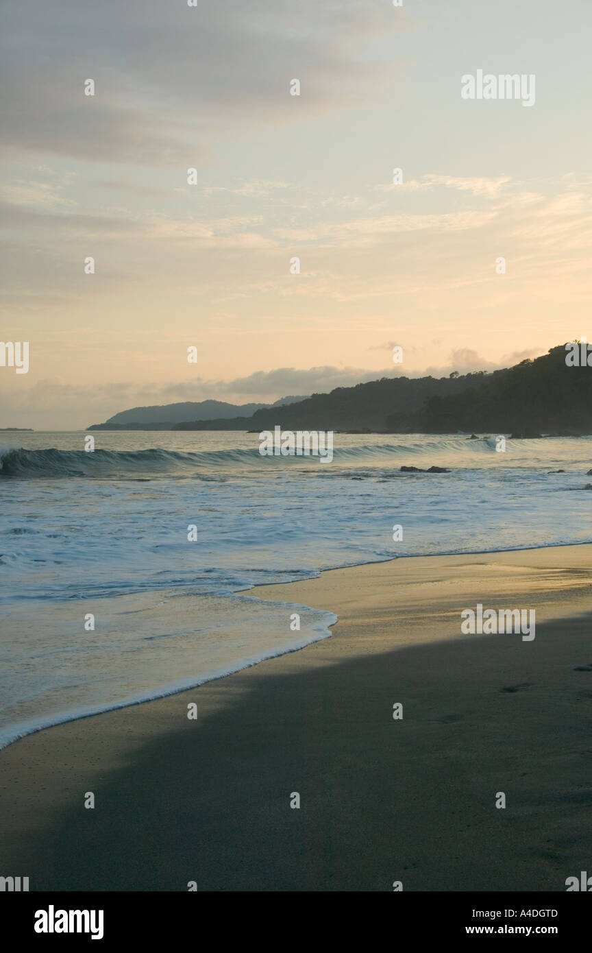 Sunset on beach at Playa Montezuma, Puntarenas, Costa Rica Stock Photo ...