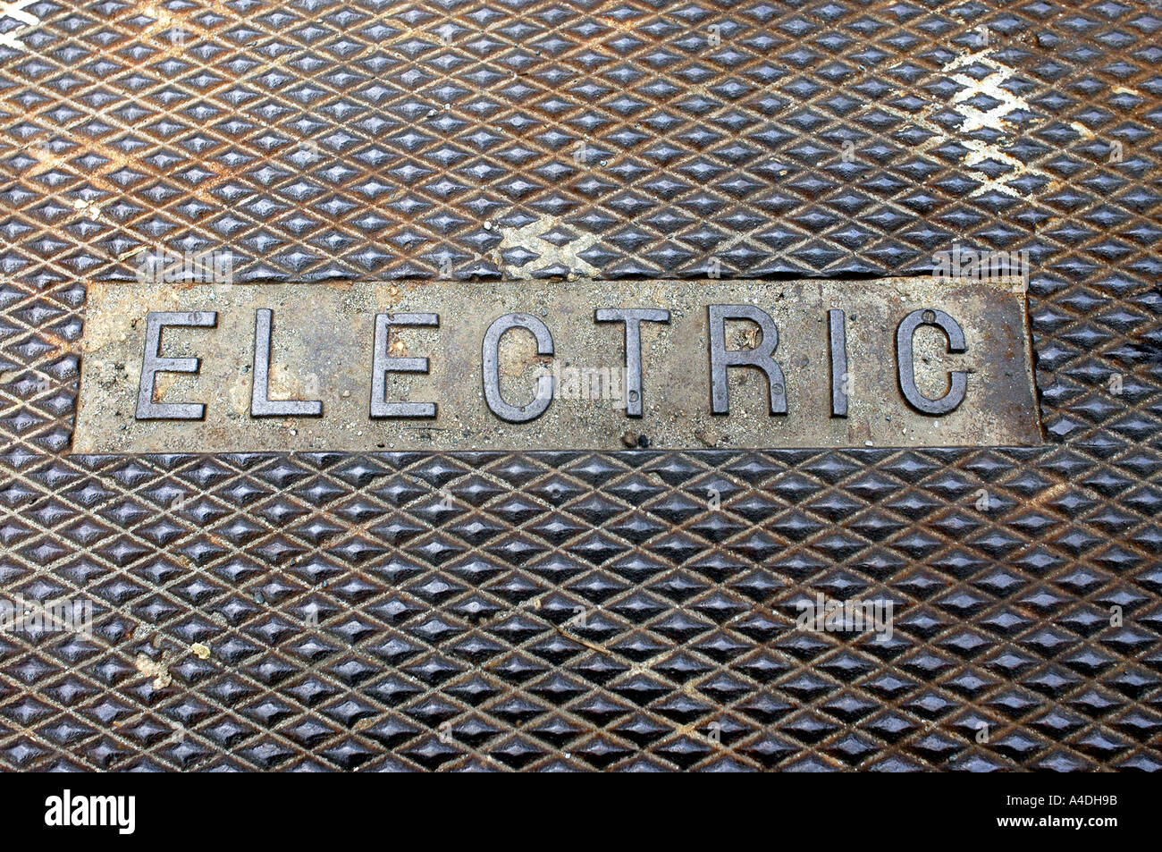 A manhole cover protecting an electrical distribution system Stock ...