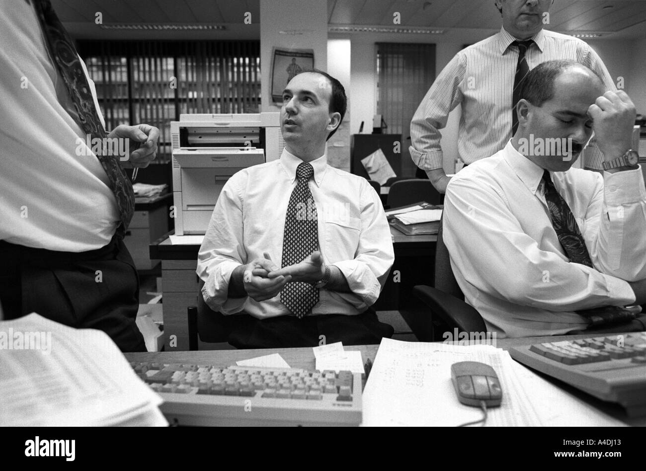 Office workers around their desks. London, UK Stock Photo - Alamy
