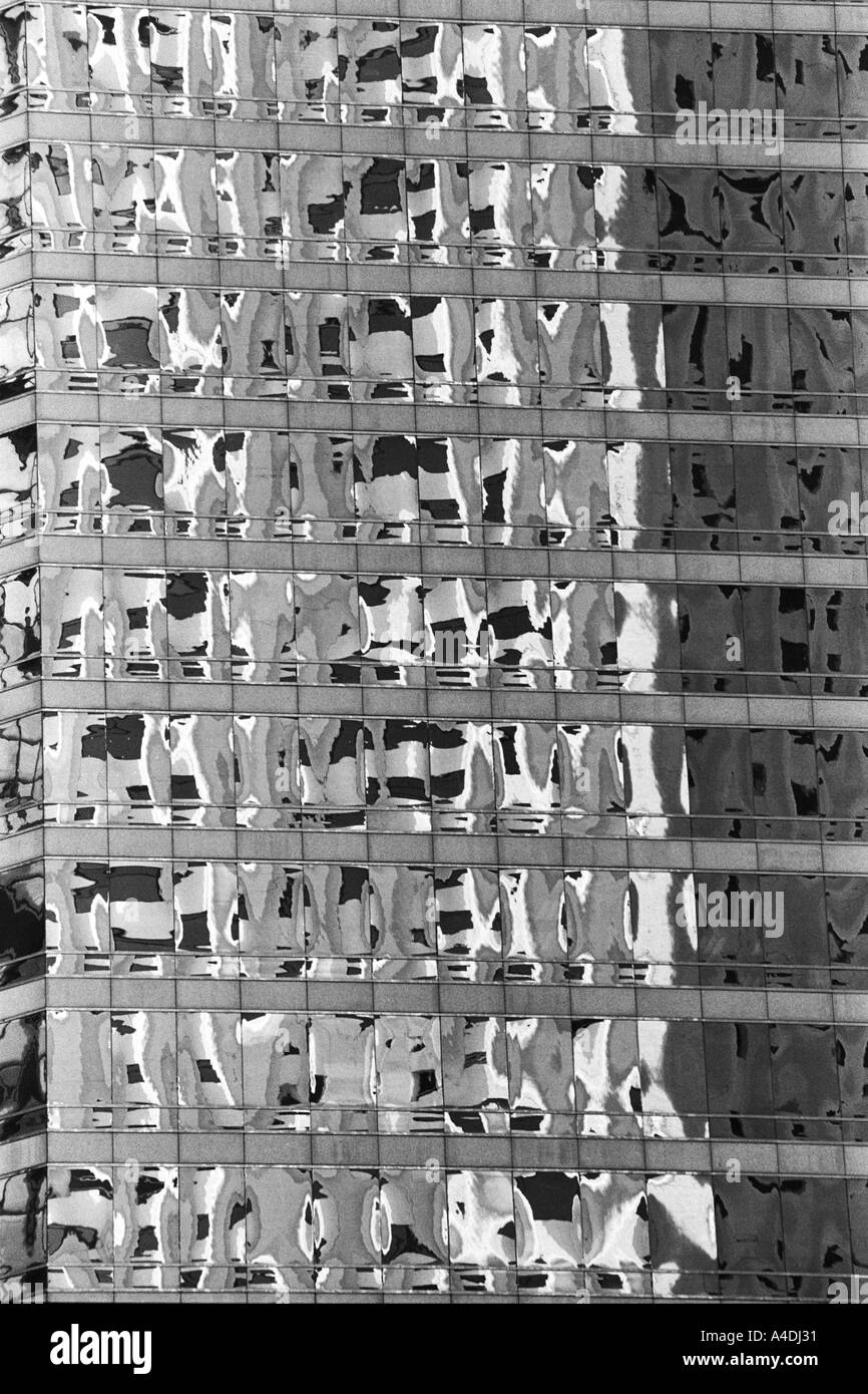 The glass front of a skyscraper. Hong Kong, Peoples' Republic of China ...