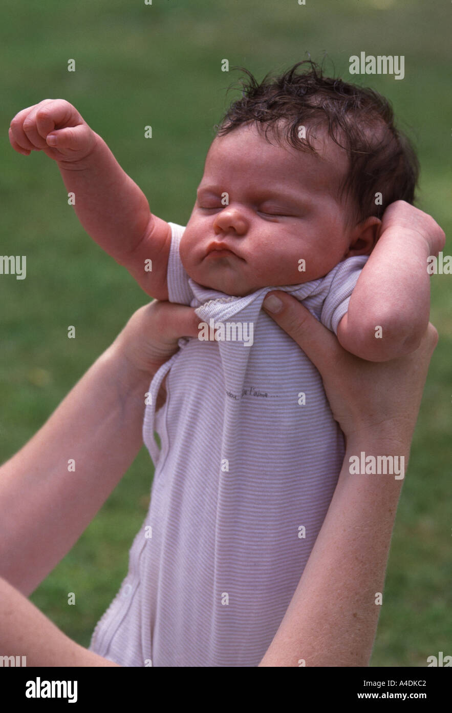 Newborn baby being held up Stock Photo - Alamy