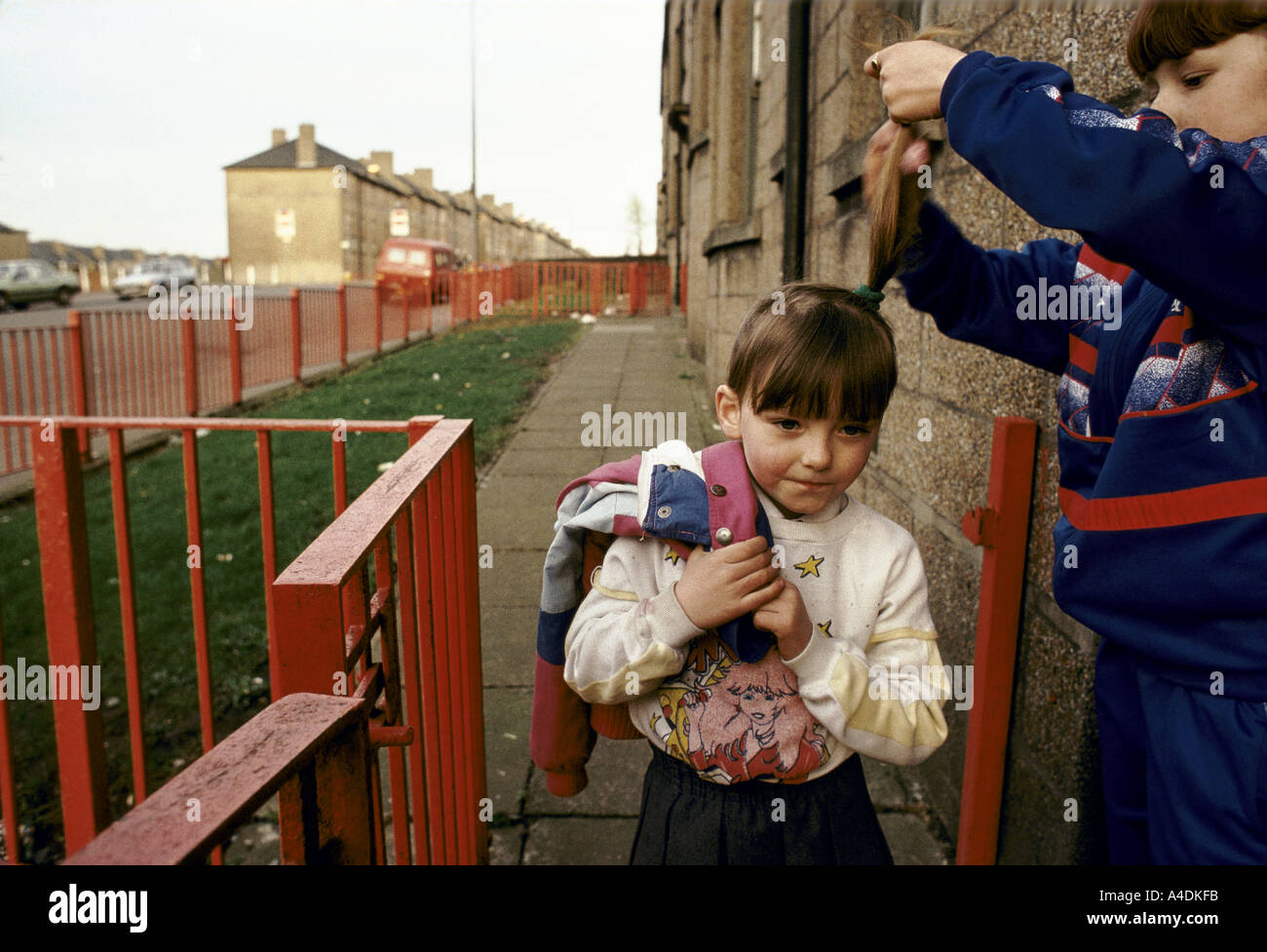 Girls brushing each others' hair, Possil Park Estate in Glasgow Stock ...