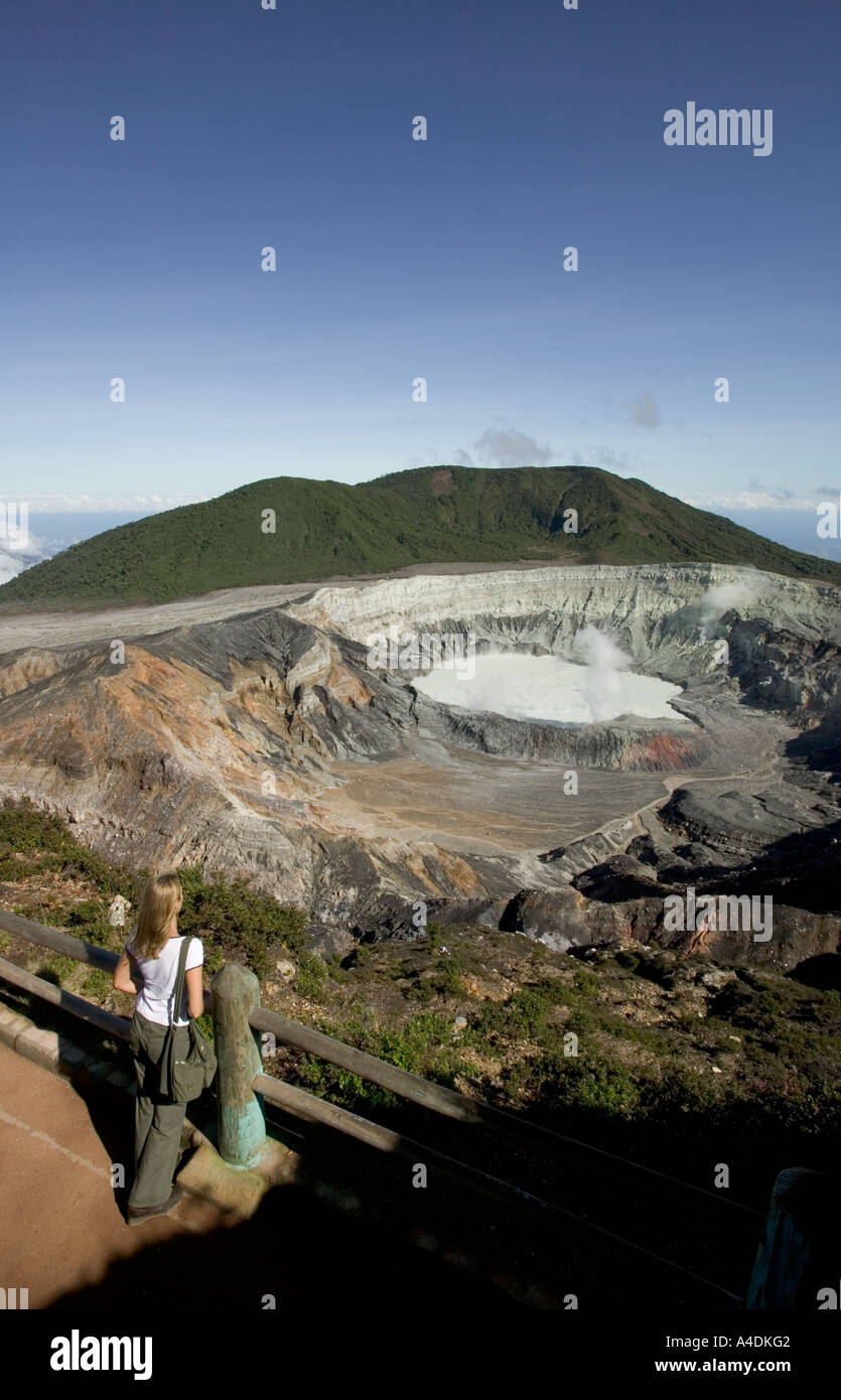 Tourist admiring the crater from viewing platform at Volcán Poás, Valle Central & Highlands ...