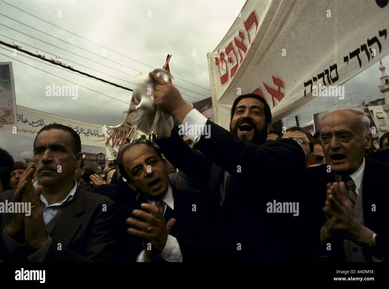The chief rabbi Ibrahim Hamra liberating one of 60 doves in a pre ...