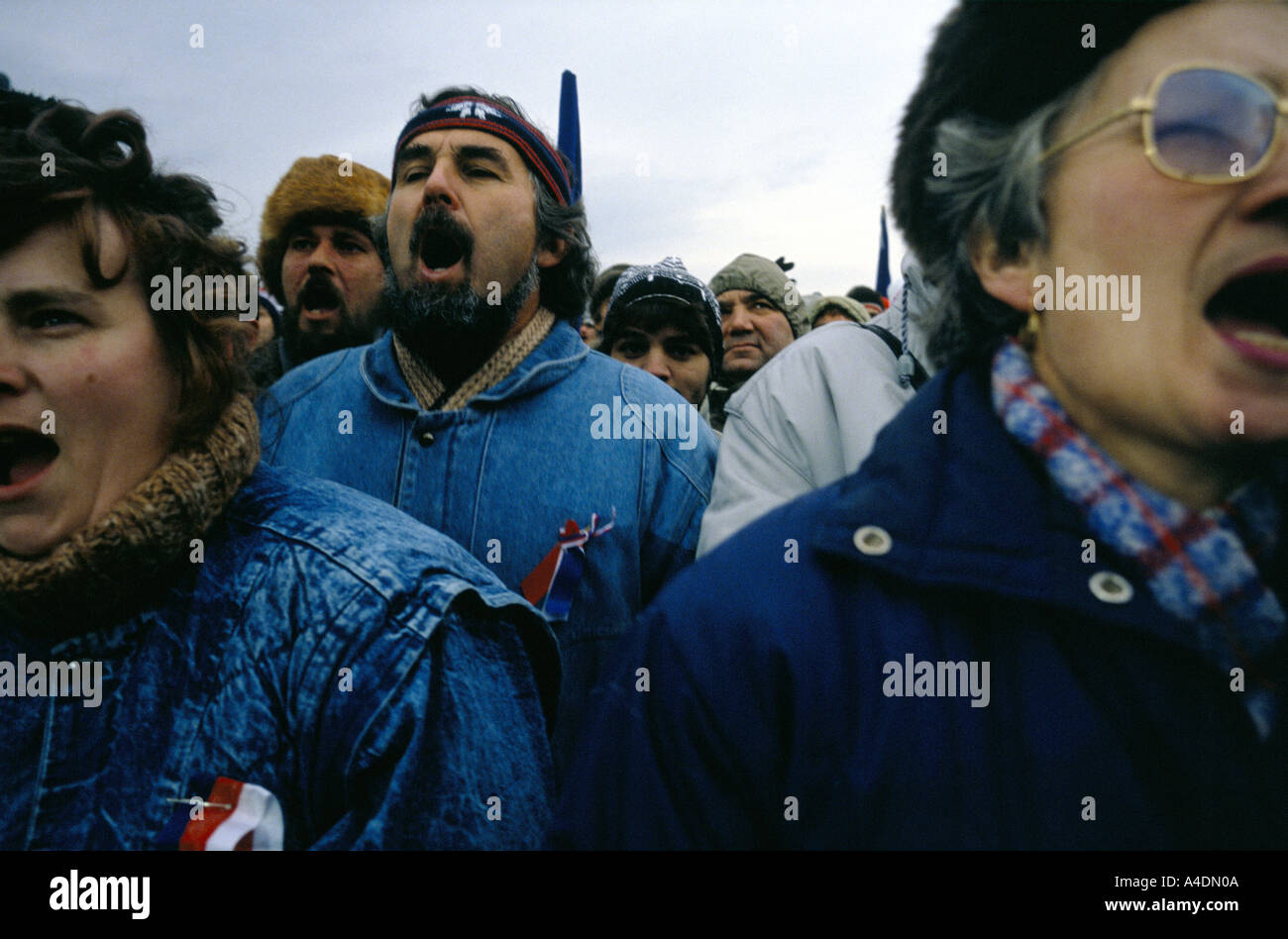 A crowd of people singing at rally in Prague during the velvet ...