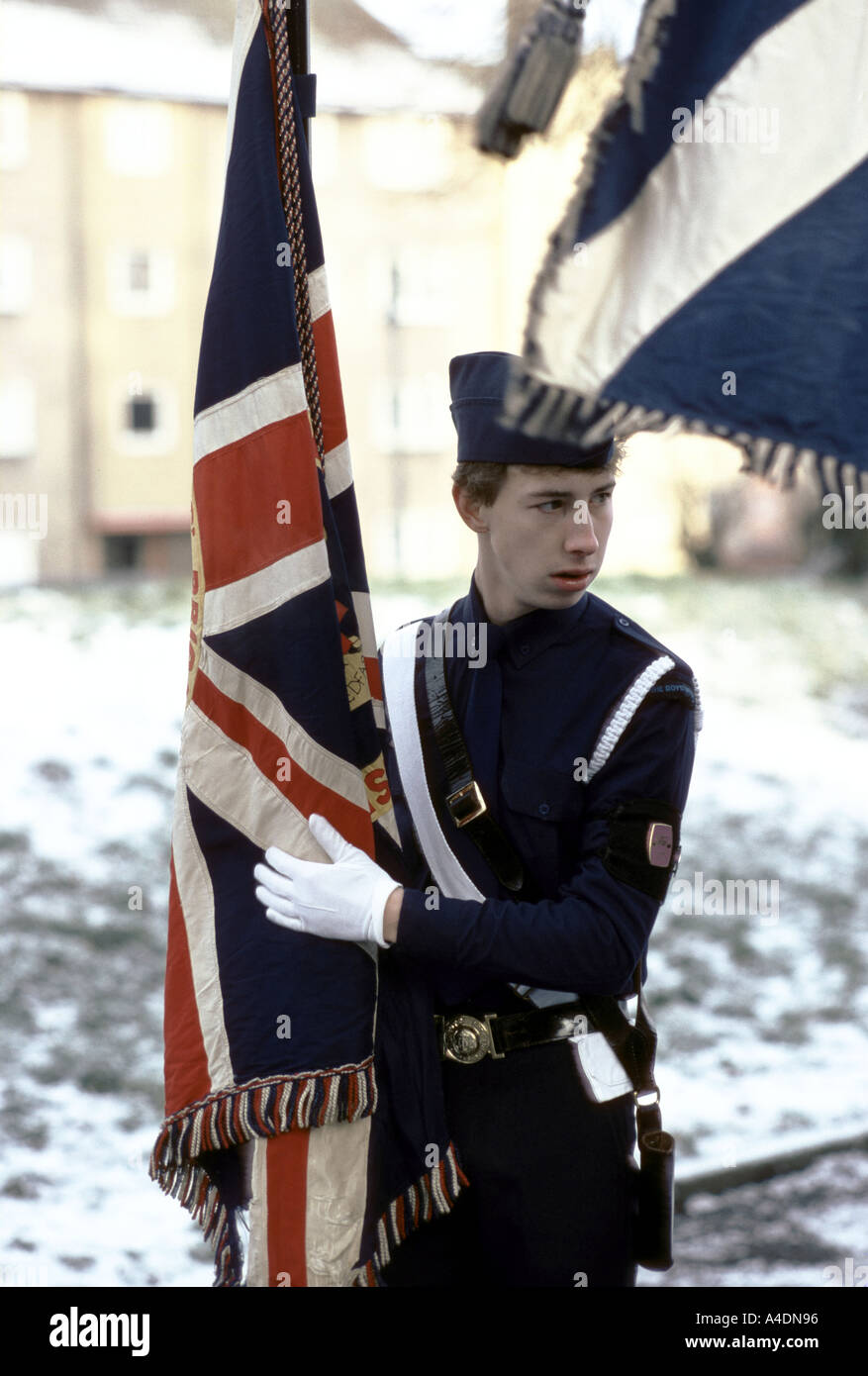 A boy holds a flagpole with the Union Jack, The Boys' Brigade, Glasgow ...
