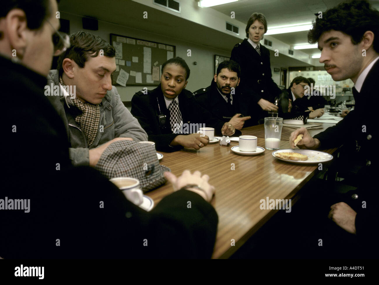 Policemen & women eating at the canteen Stock Photo - Alamy