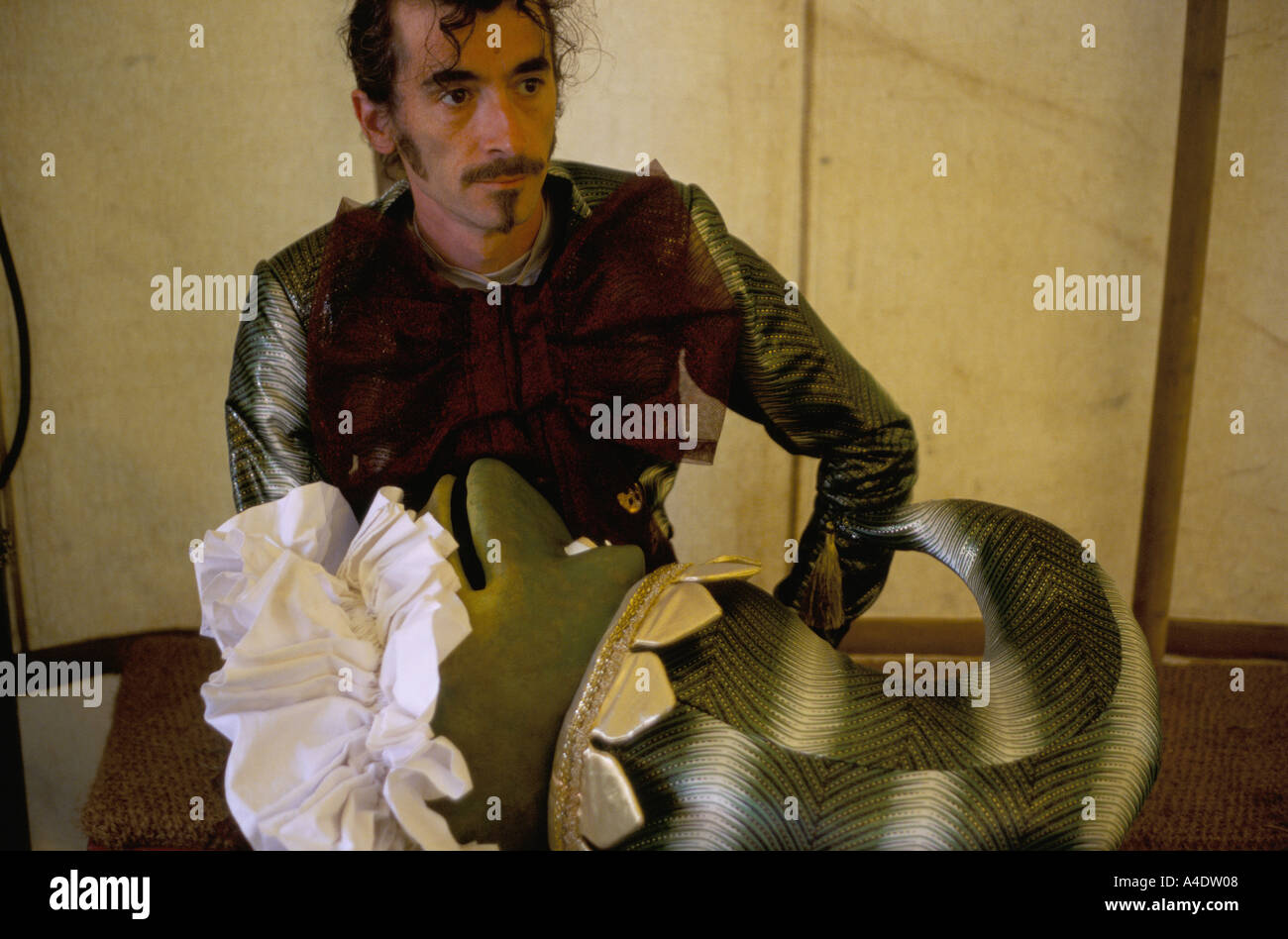 a performer dressed as a frog waits to enter the big top Giffords ...