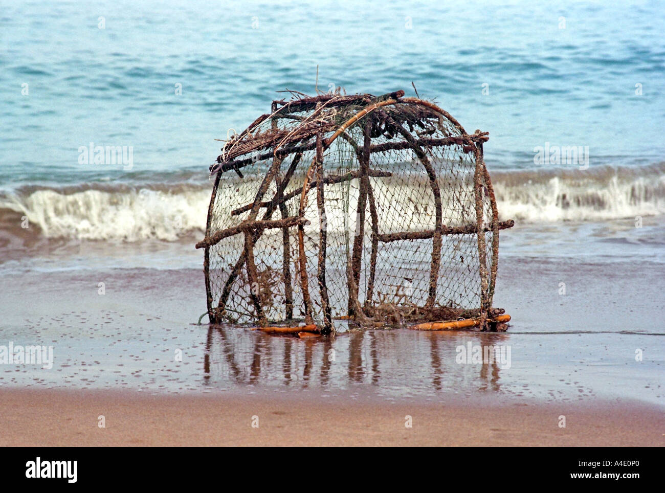 A simple wire fish trap on the beach at Ko Lanta, southern Thailand ...