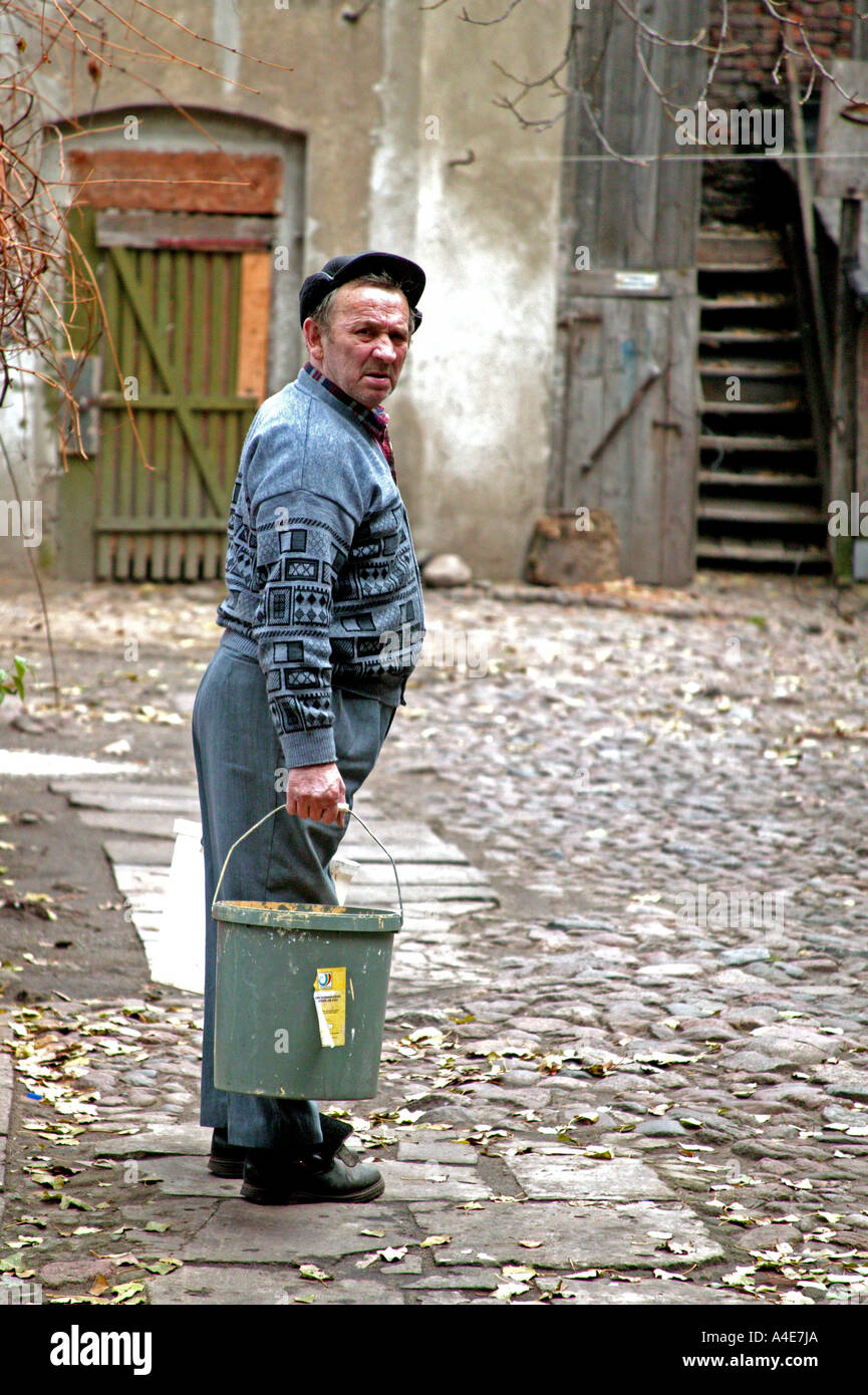 Polish workman with bucket. Warsaw Stock Photo - Alamy
