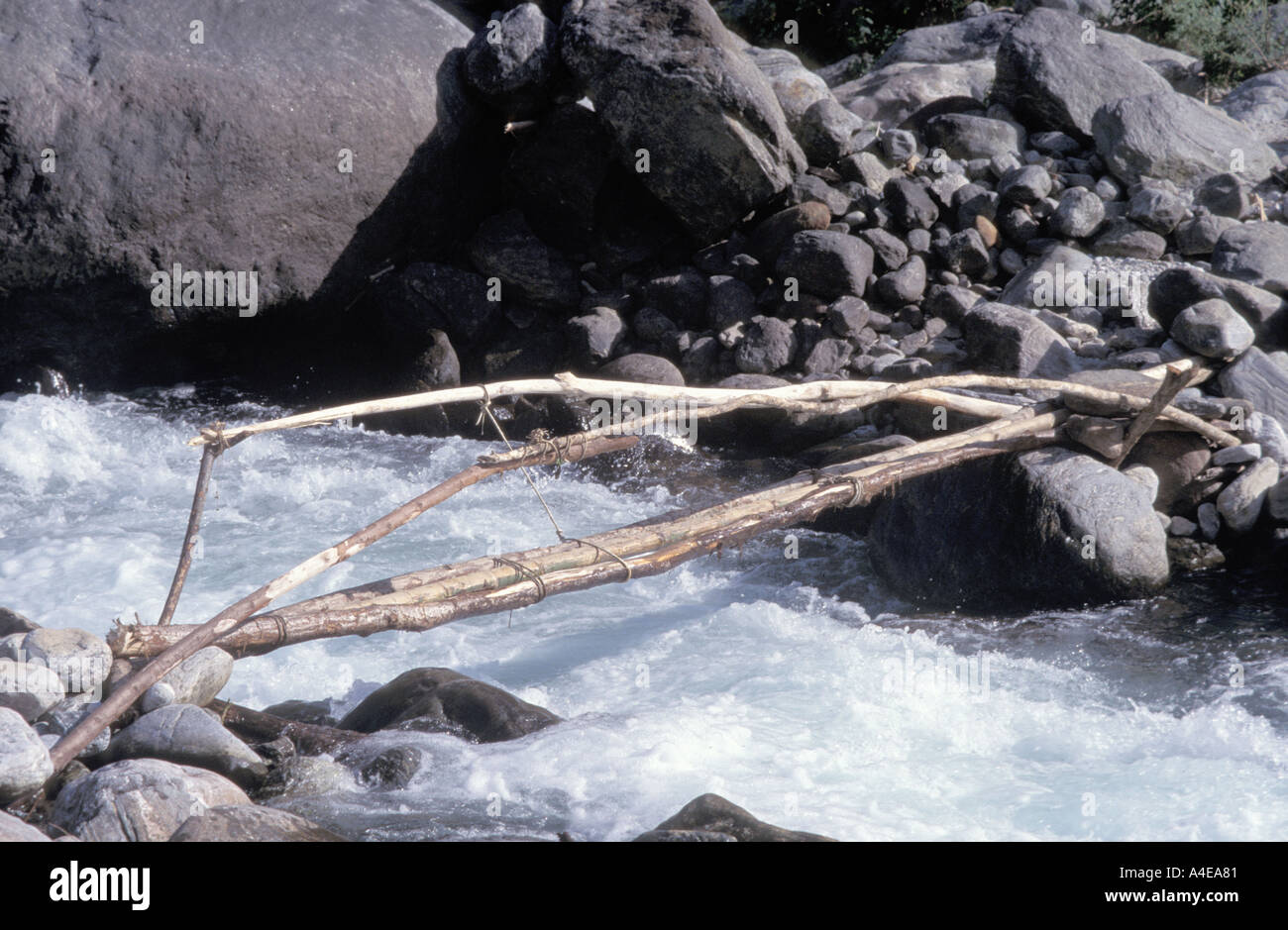 Simple bridge made from Poles Dobhan Stock Photo - Alamy