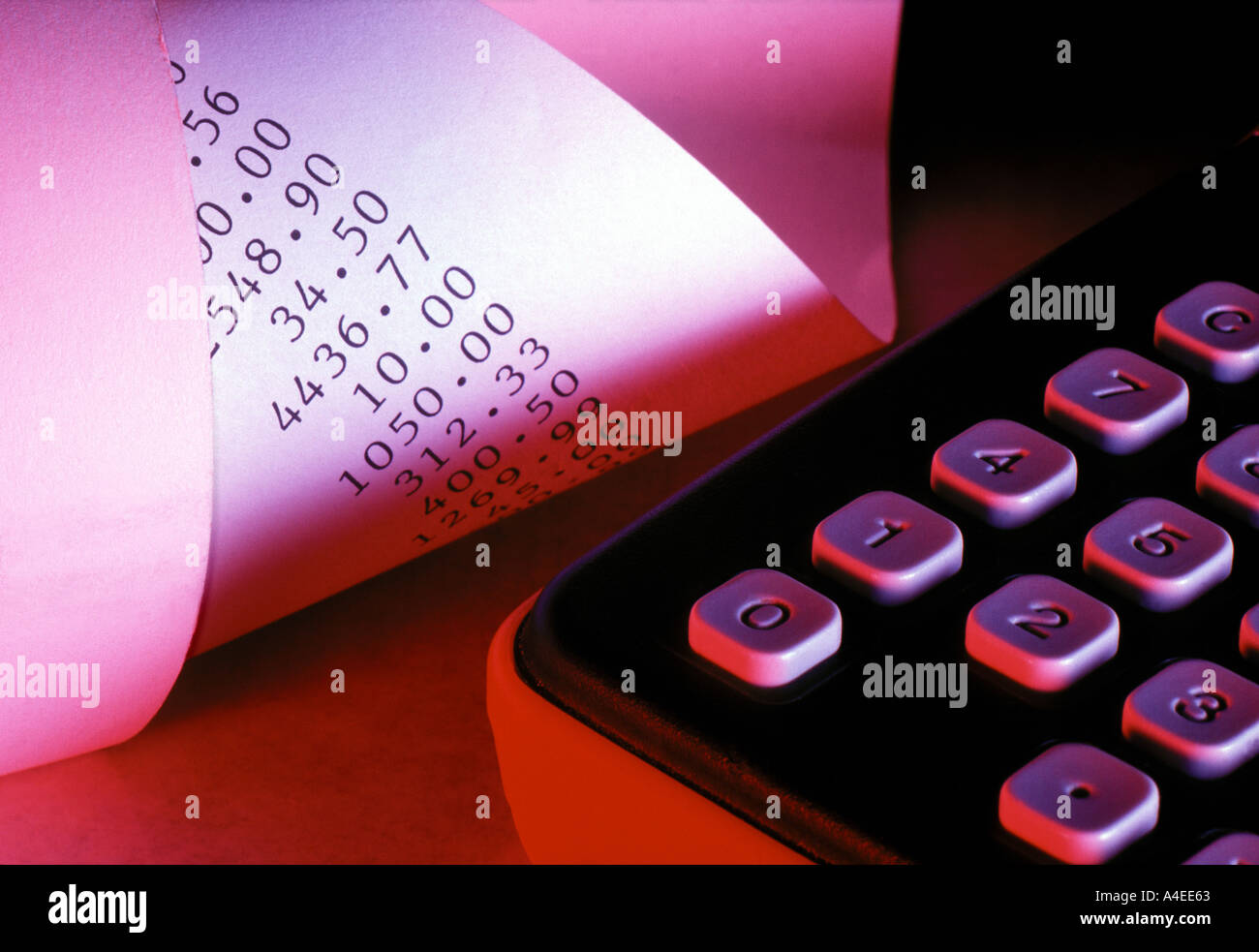calculator with figure list printout roll Stock Photo - Alamy