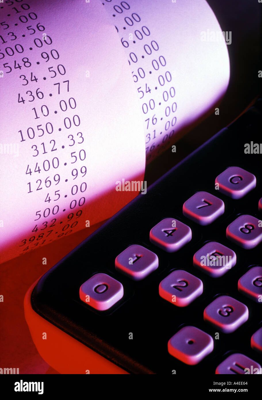 calculator with figure list printout rolls Stock Photo - Alamy