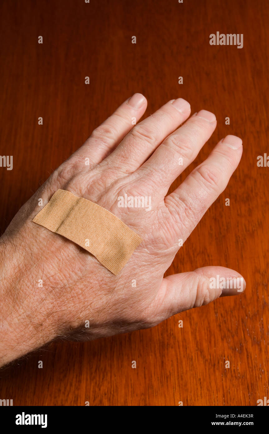 A band-aid on a man's hand Stock Photo - Alamy