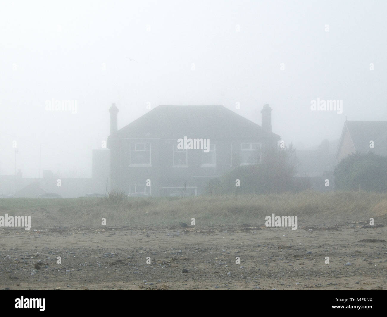 Houses seen through the haze of fog Stock Photo - Alamy