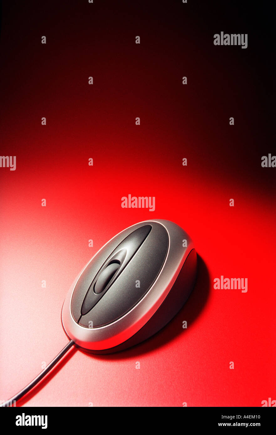 Black and silver computer mouse on red background Stock Photo - Alamy