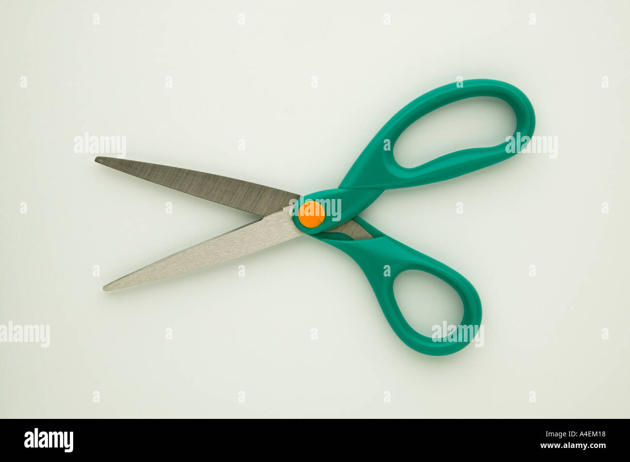 Pair of open scissors on white background Stock Photo - Alamy